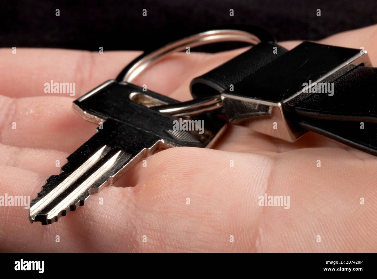 Hand holding metal keyless hi-res stock photography and images - Alamy
