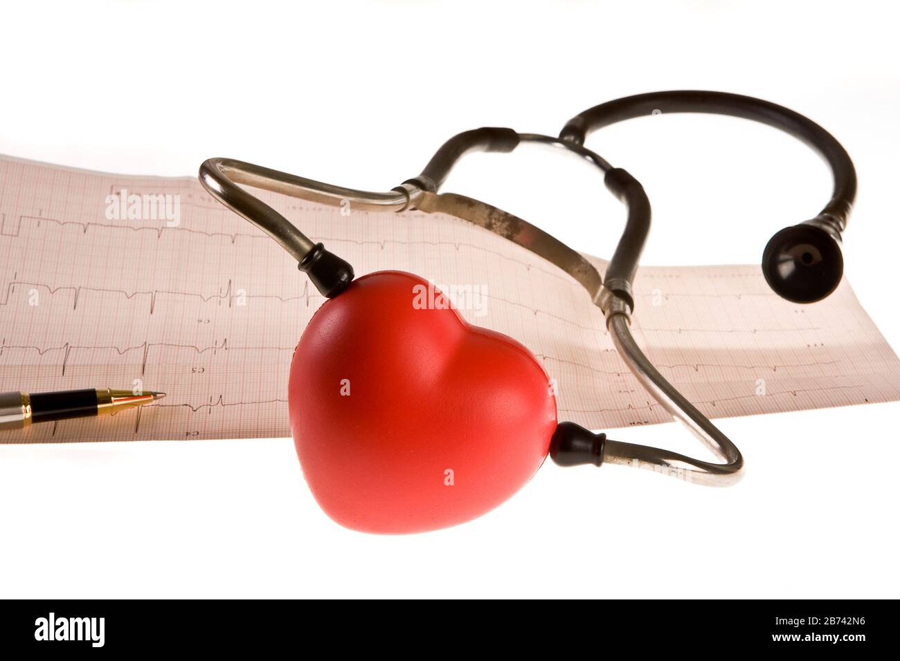 Stethoscope, pen and heart lying on a cardiogram Stock Photo - Alamy
