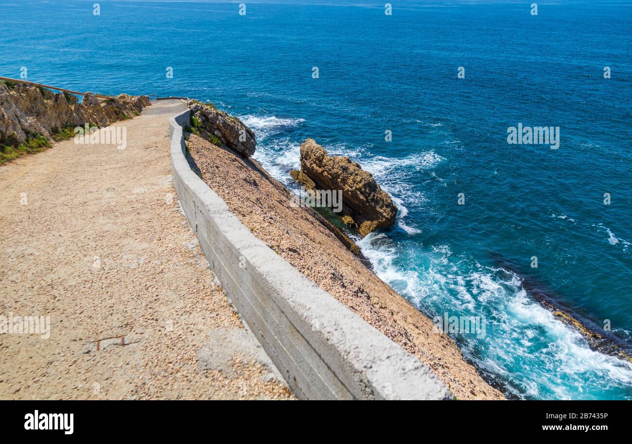 concrete cliff edge overlooking blue Adriatic Sea Stock Photo - Alamy
