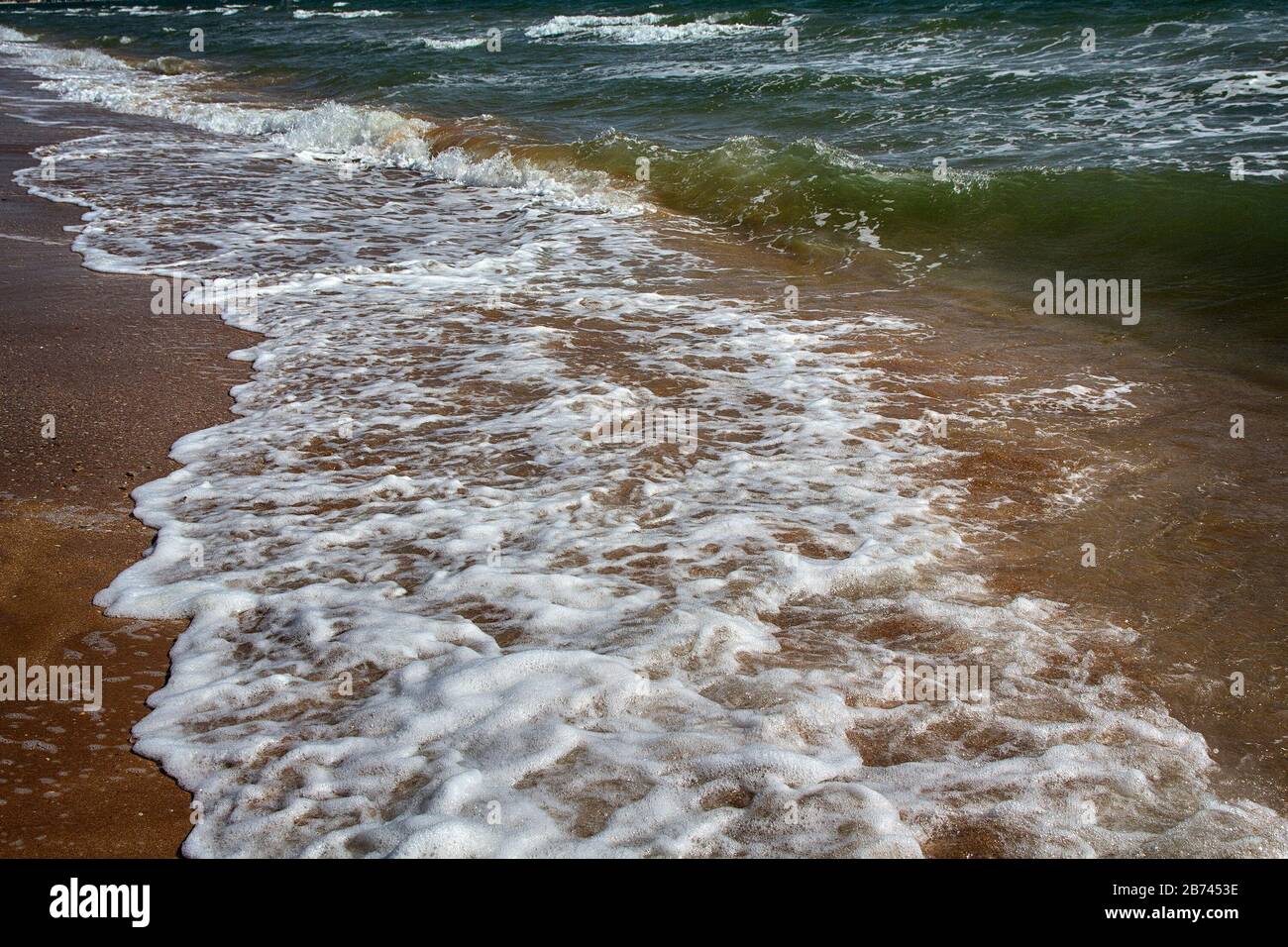 Wave of the sea on the sand beach Stock Photo - Alamy