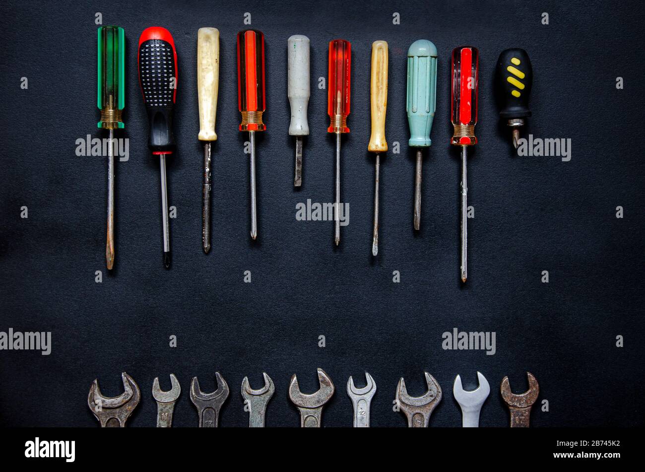 Screwdrivers of different shapes, sizes and colors for repair and ...