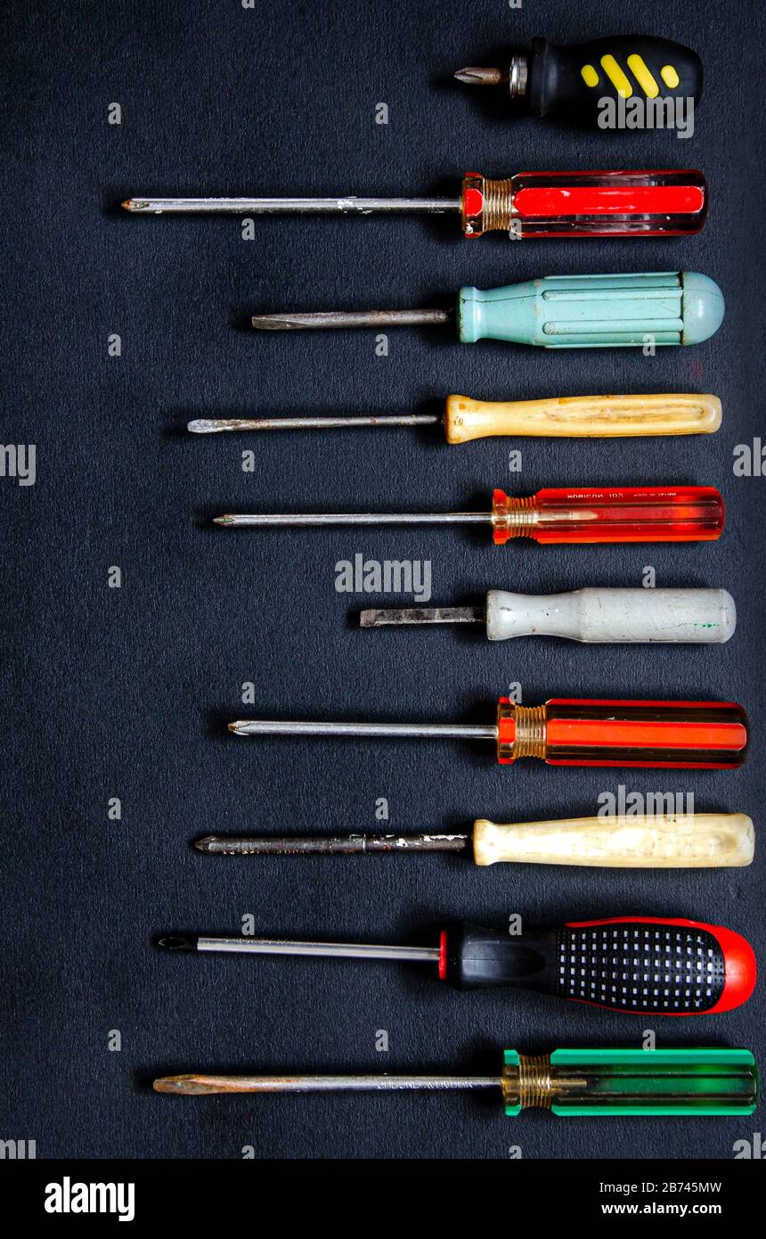 Screwdrivers of different shapes, sizes and colors for repair and ...