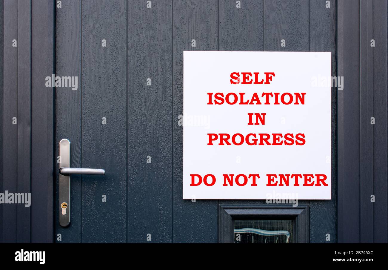Coronavirus self isolation sign outside a front door in England Stock ...
