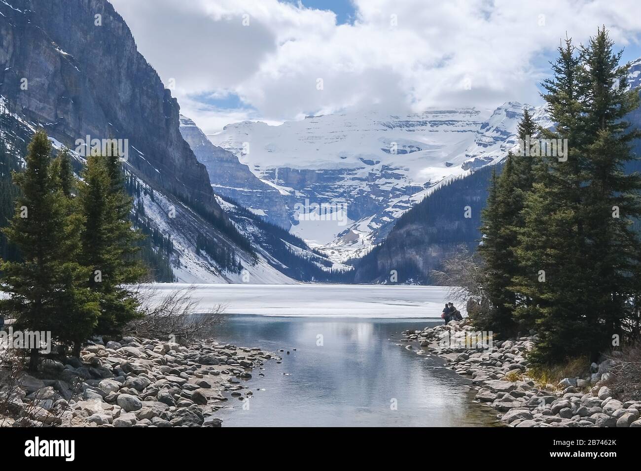 Mount fairview, partly frozen lake, with reflection in water. Lake ...
