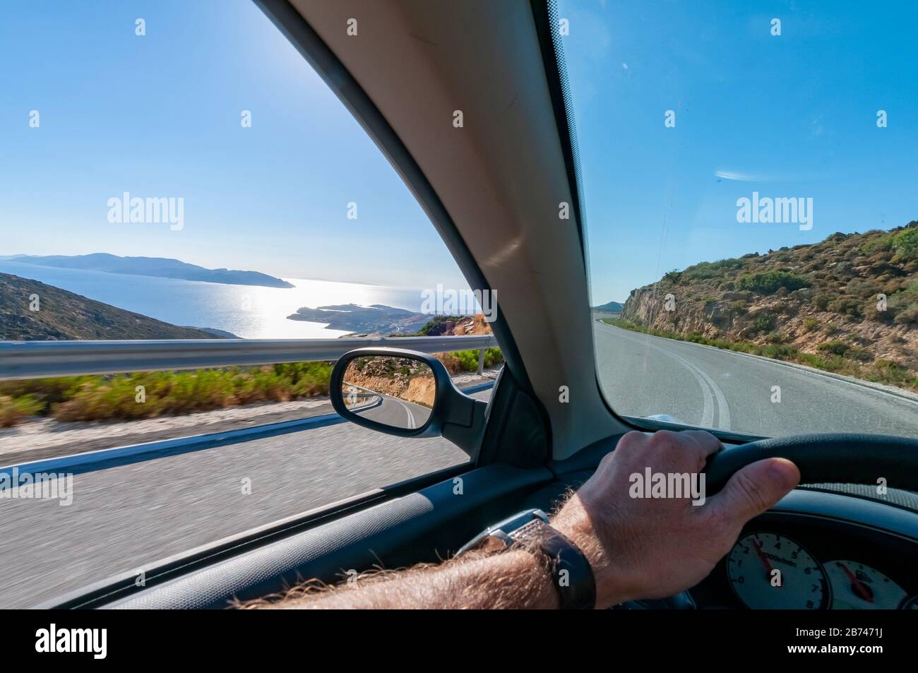 Driving rent-a-car Ios Island Greek Islands Greece Stock Photo - Alamy