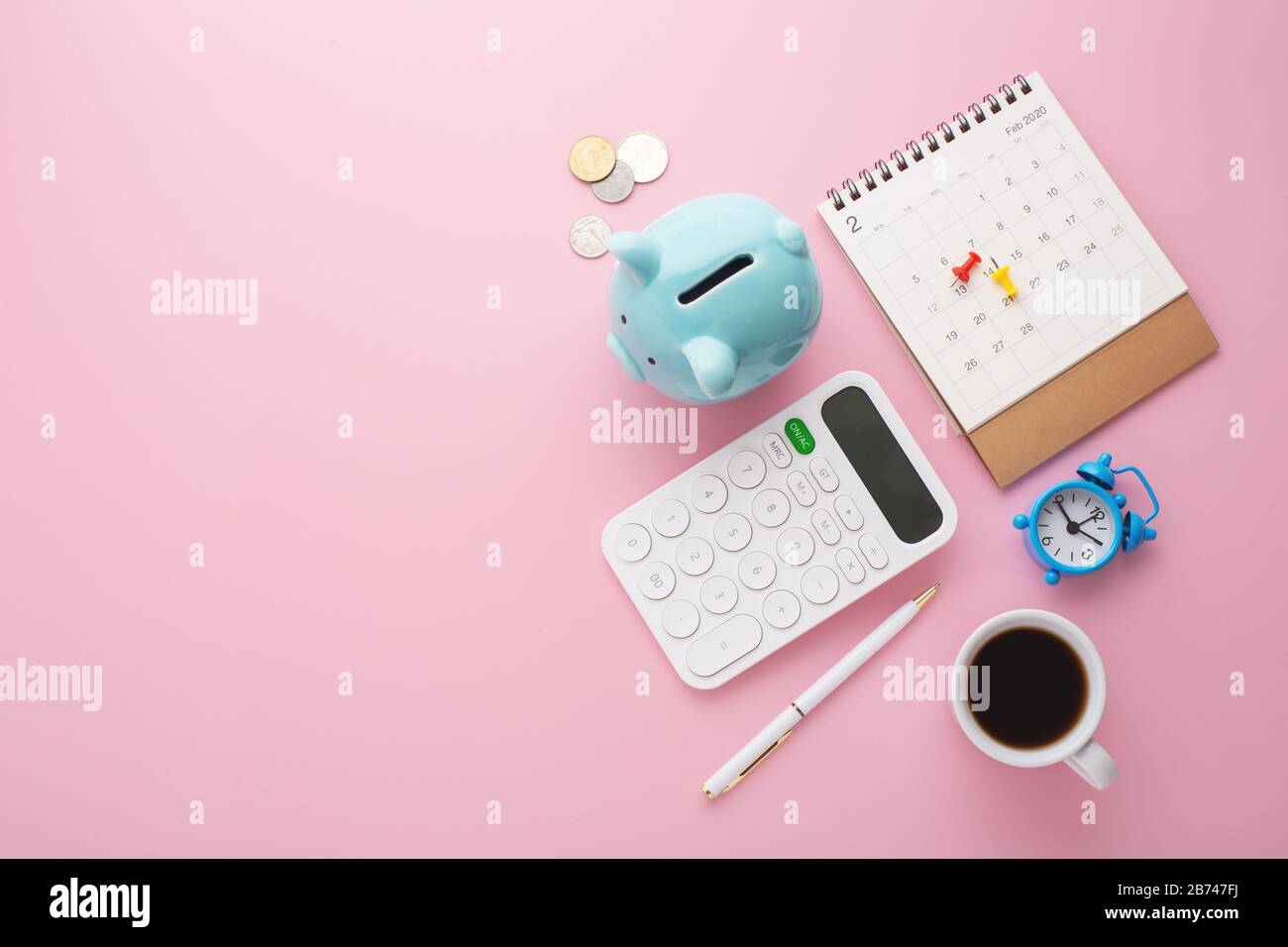 Piggy bank, calculator, calendar, clock and coin on pink background ...