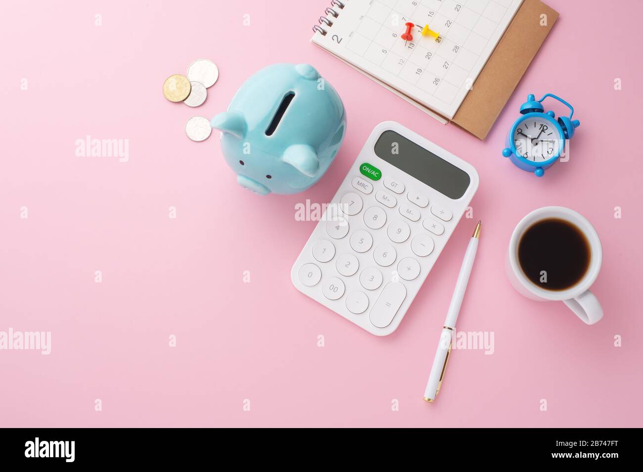 Piggy bank, calculator, calendar, clock and coin on pink background ...