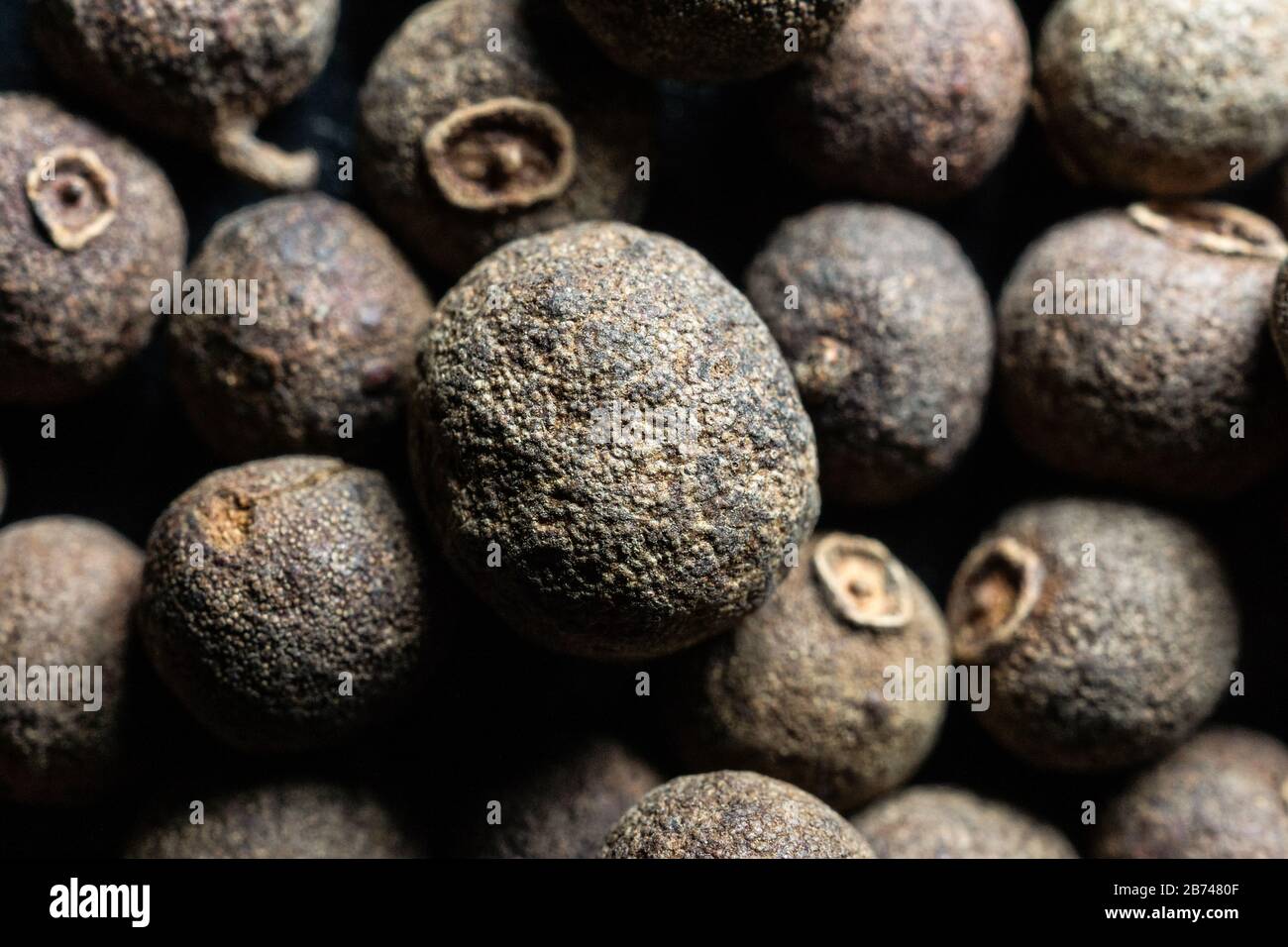Black pepper zoomed in on and close up texture Stock Photo - Alamy