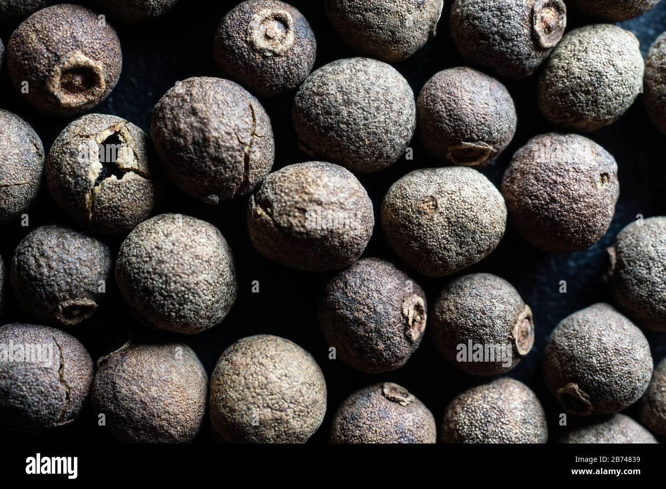 Black pepper zoomed in on and close up texture Stock Photo - Alamy