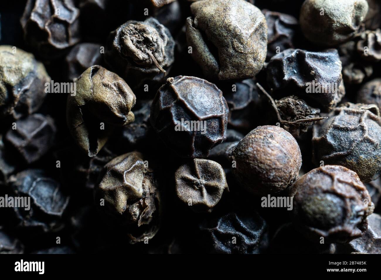 Black pepper zoomed in on and close up texture Stock Photo - Alamy