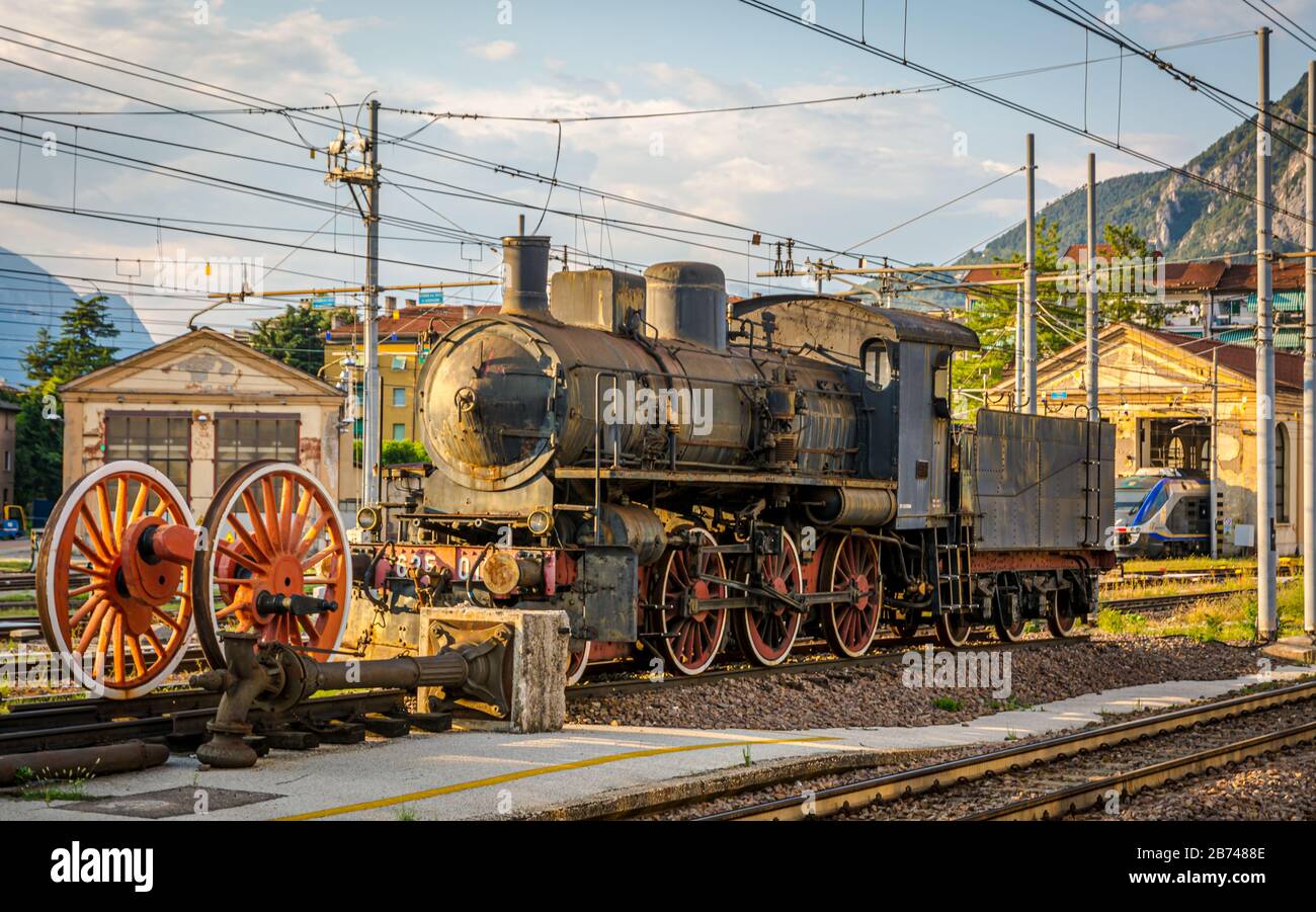 old locomotive (steam engine) on display at the Trento railway station ...