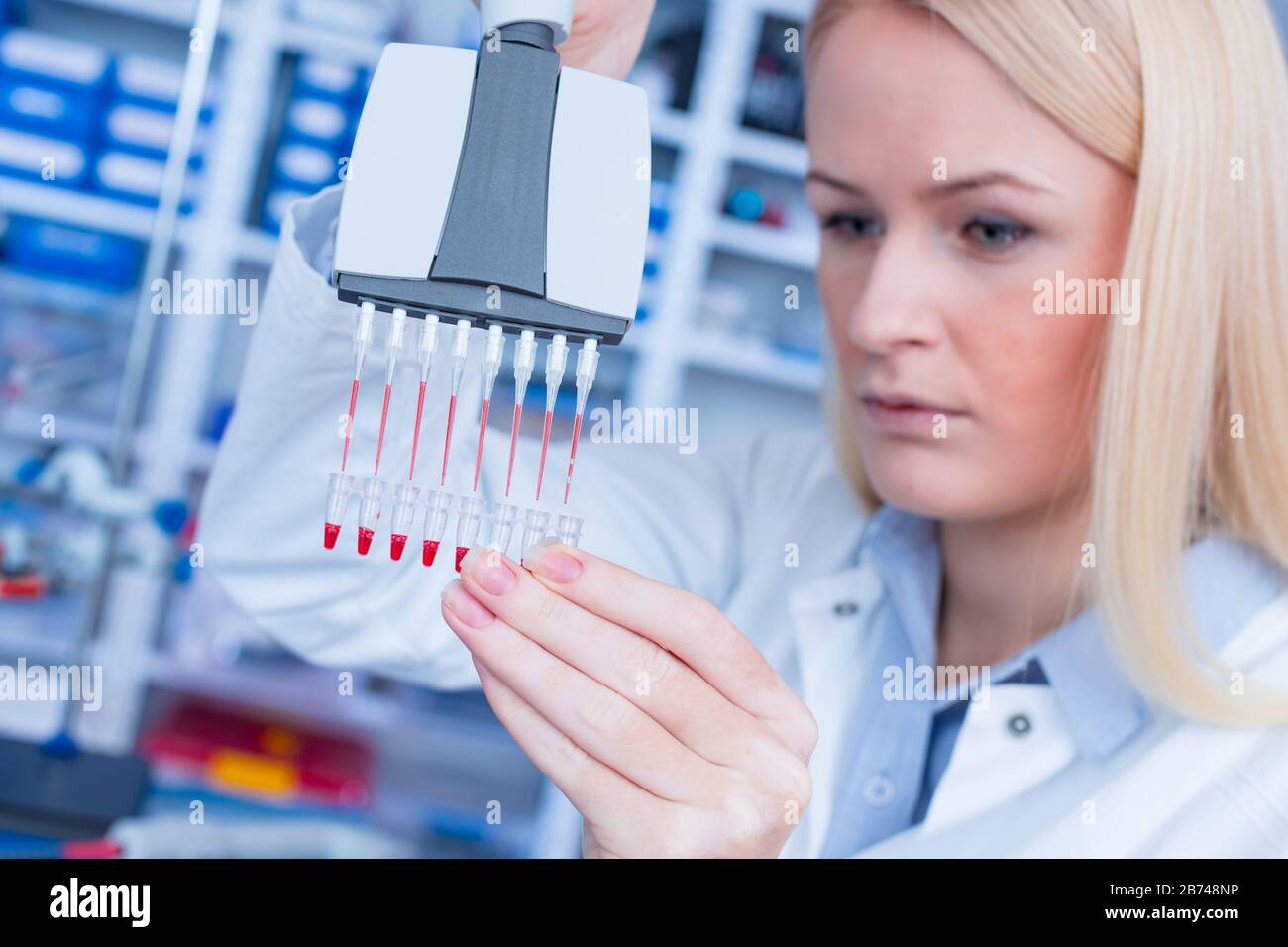 Girl laboratory Assistant works with an antiviral drug in a ...