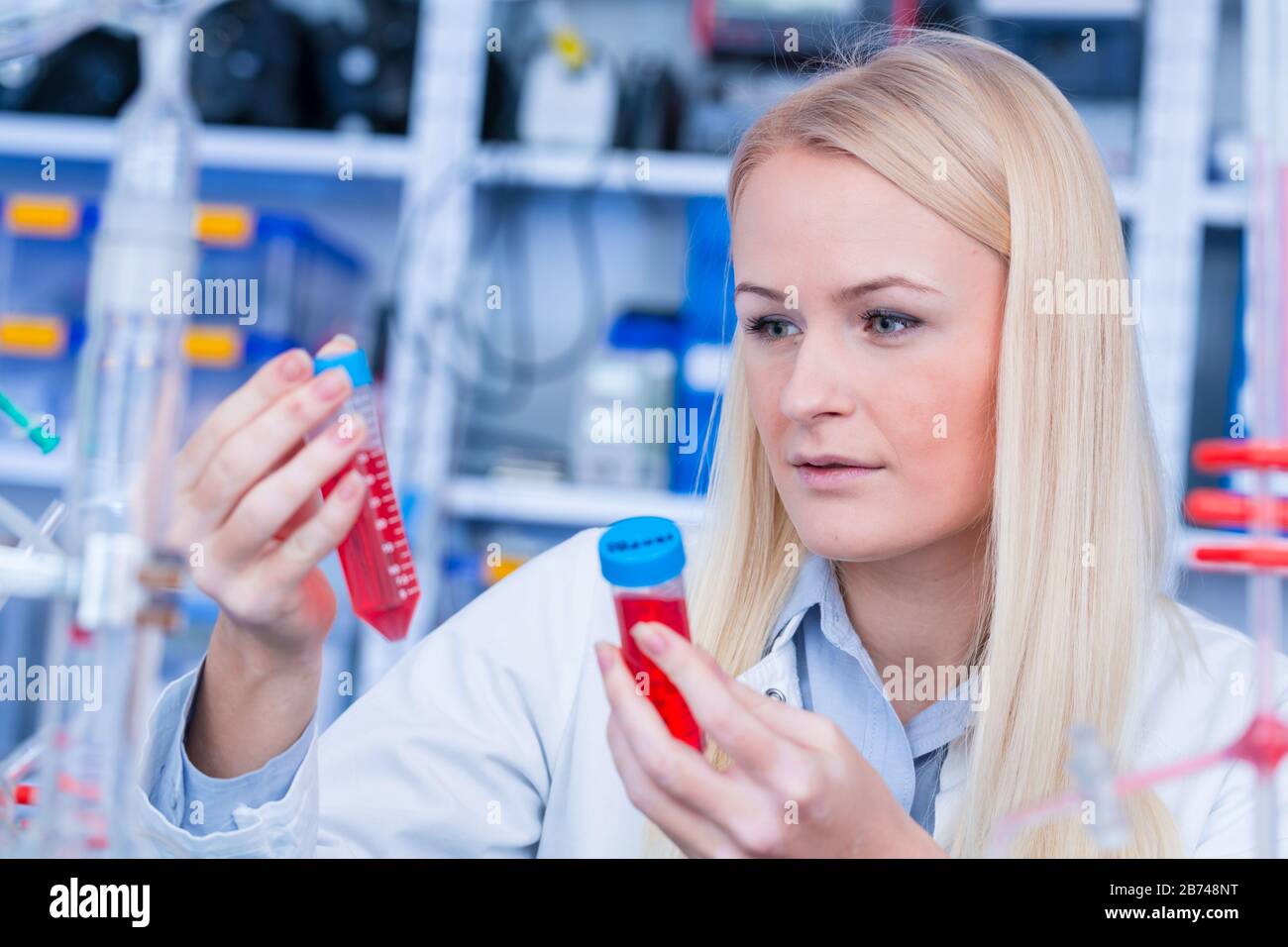 Girl laboratory Assistant works with an antiviral drug in a ...