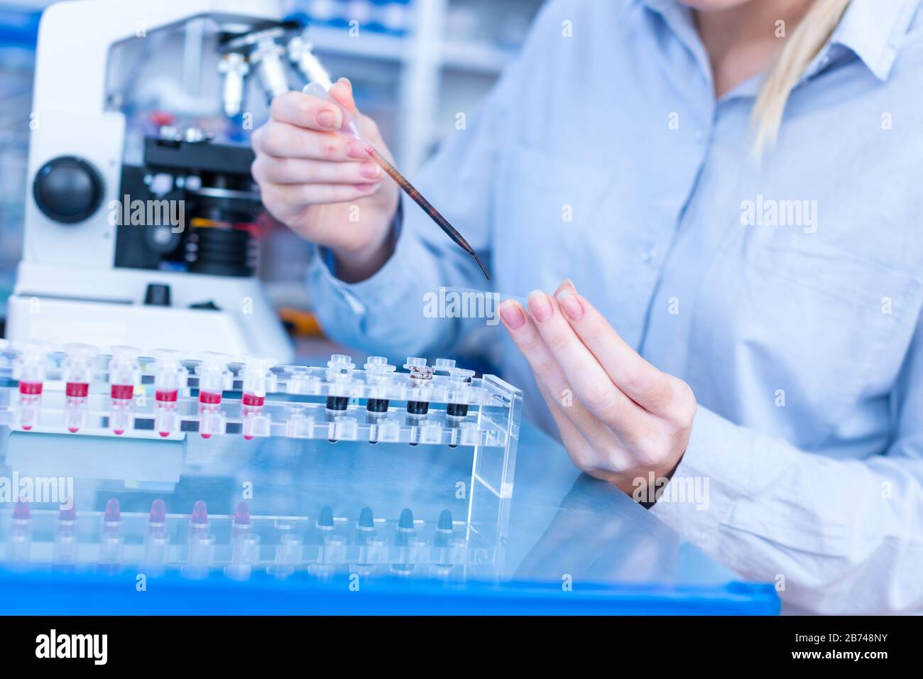 Girl laboratory Assistant works with an antiviral drug in a ...