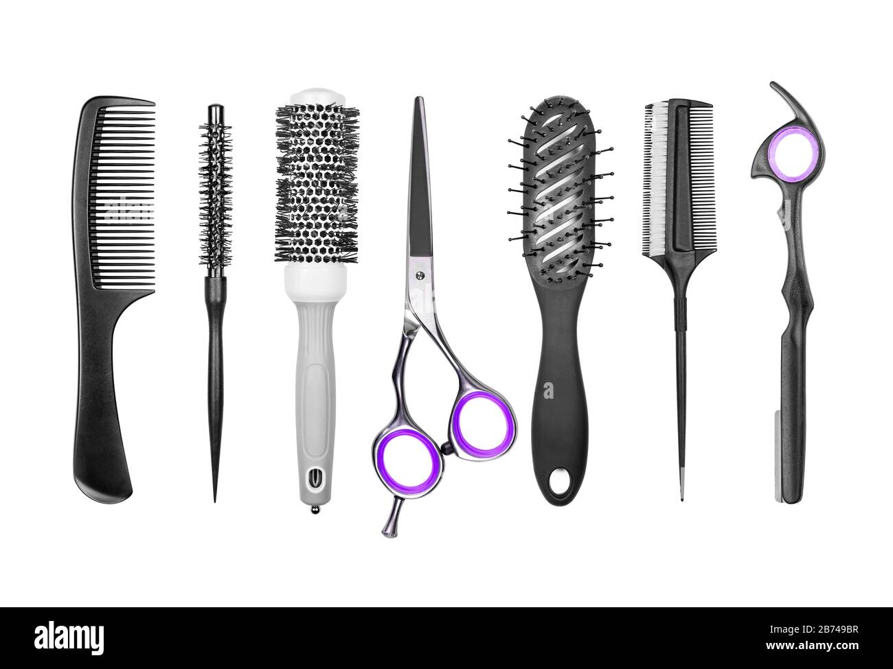 set of professional hair brushes and scissors isolated on the white ...