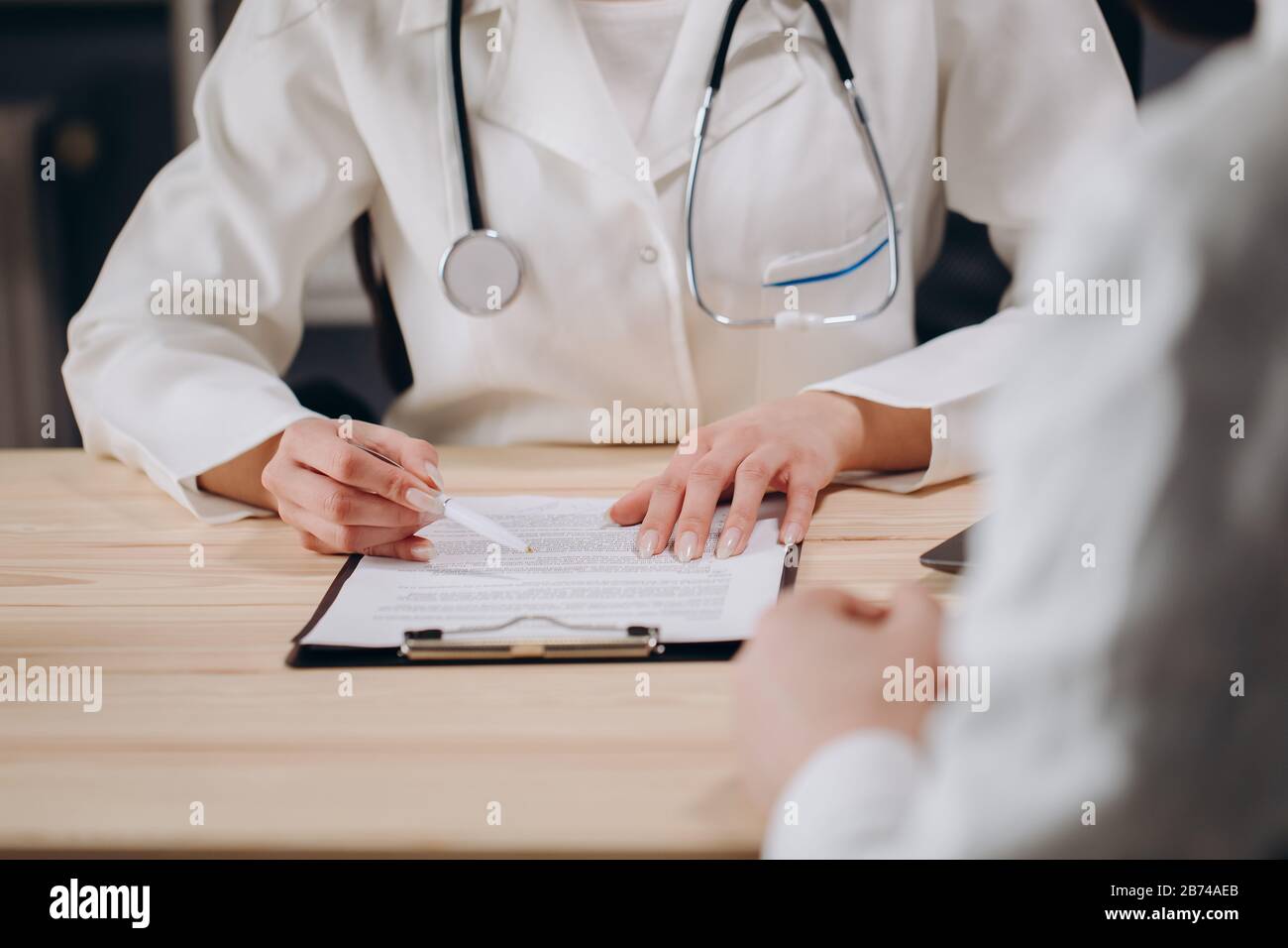 A Female Physician A Interviewing a Patient Stock Photo - Alamy