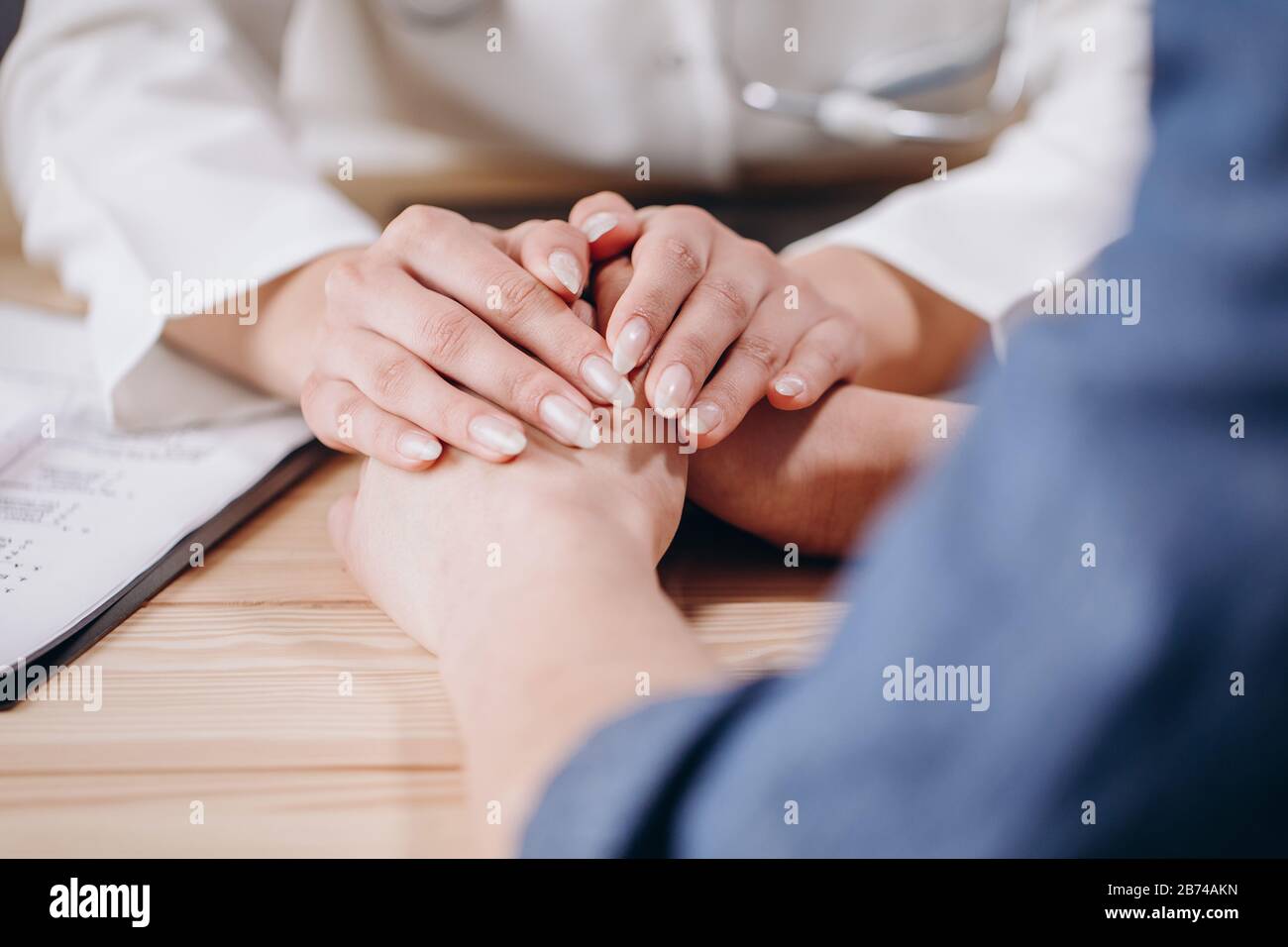 Medical Employee Covering Patient's Hands With Her Own Hands Stock ...