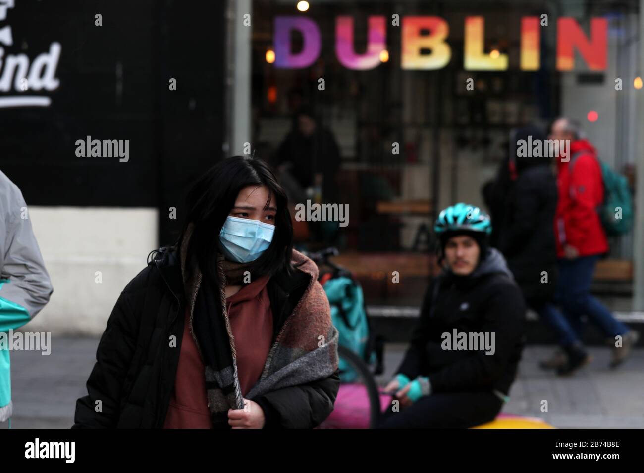 A woman wearing a face mask in dublins city centre hi-res stock ...