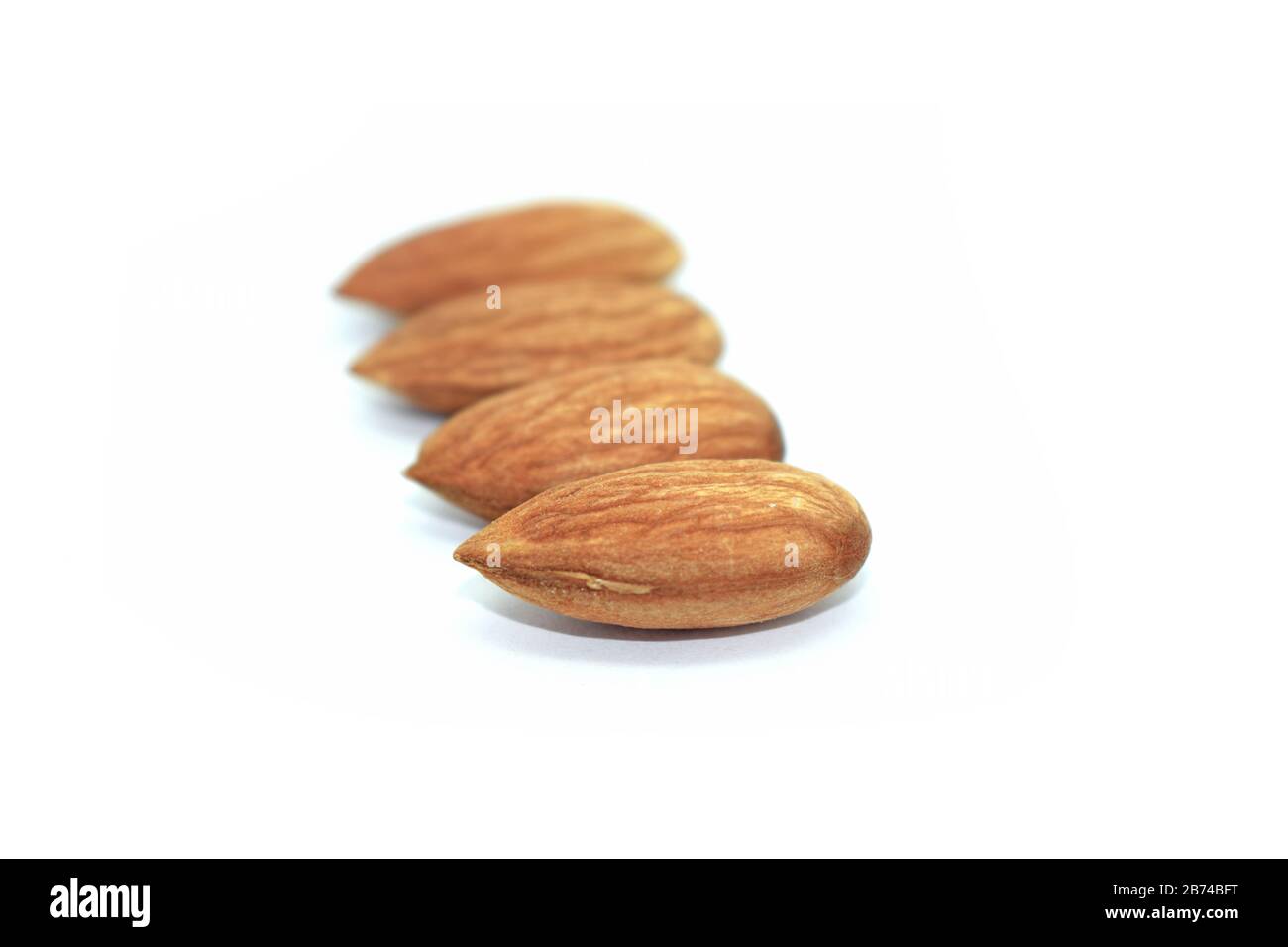 Almond isolated on white background Stock Photo - Alamy