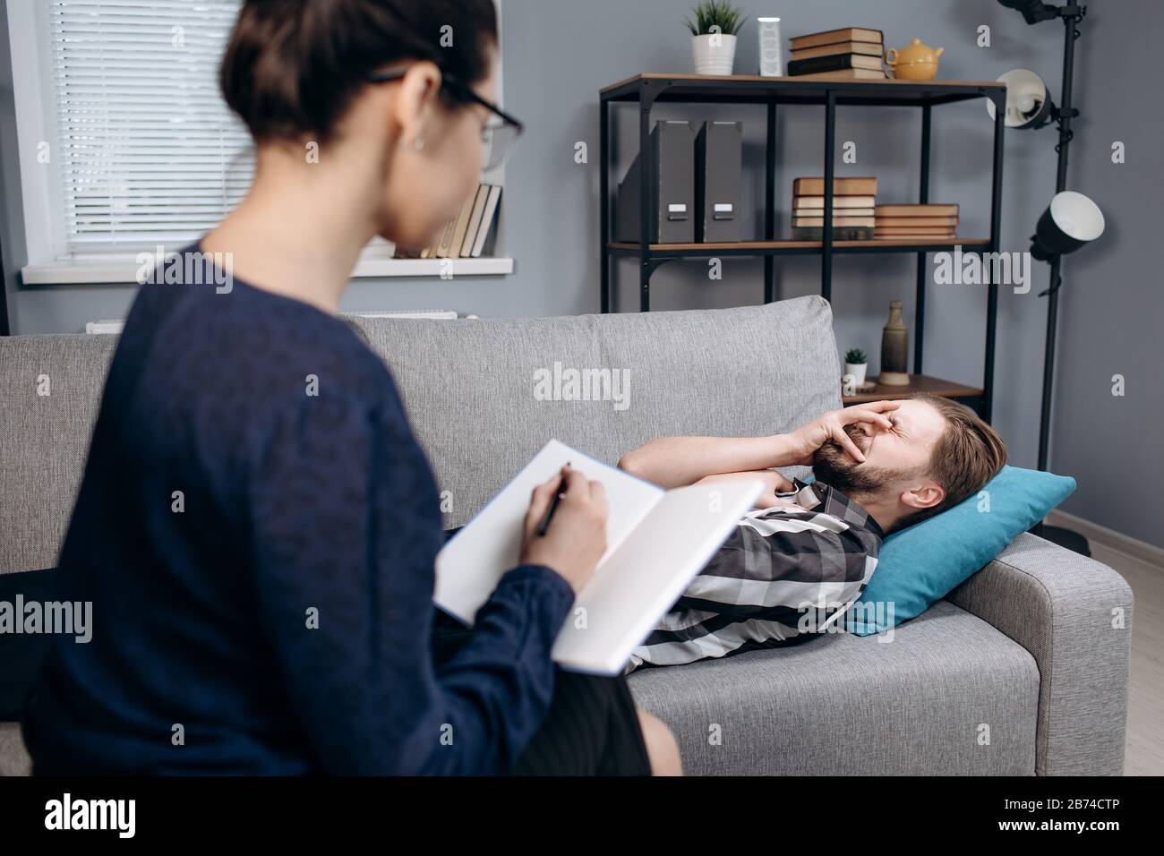 Bearded mature patient crying during session with therapist Stock Photo ...