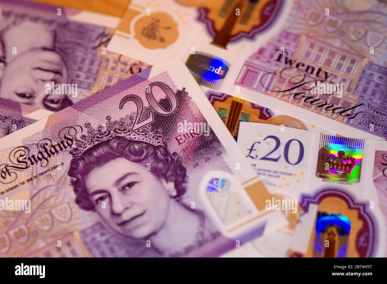 uk twenty pound notes trapped in mousetrap Stock Photo - Alamy