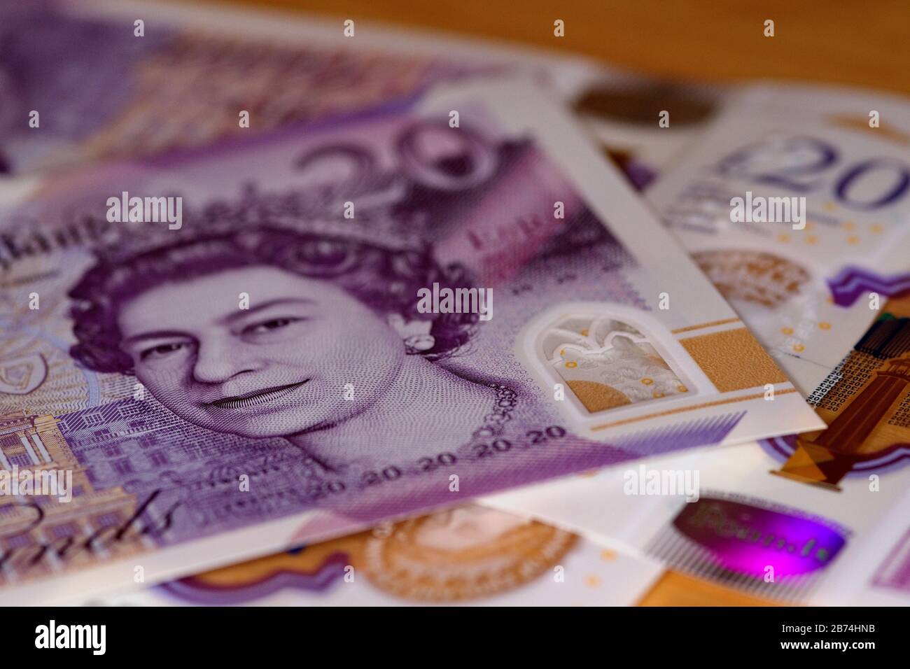 uk twenty pound notes trapped in mousetrap Stock Photo - Alamy