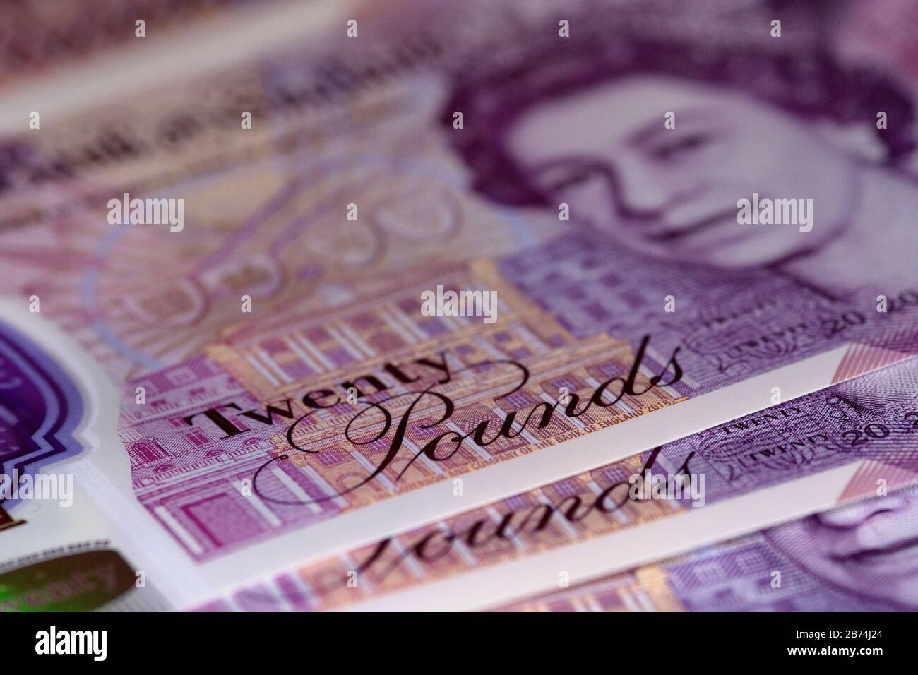uk twenty pound notes trapped in mousetrap Stock Photo - Alamy