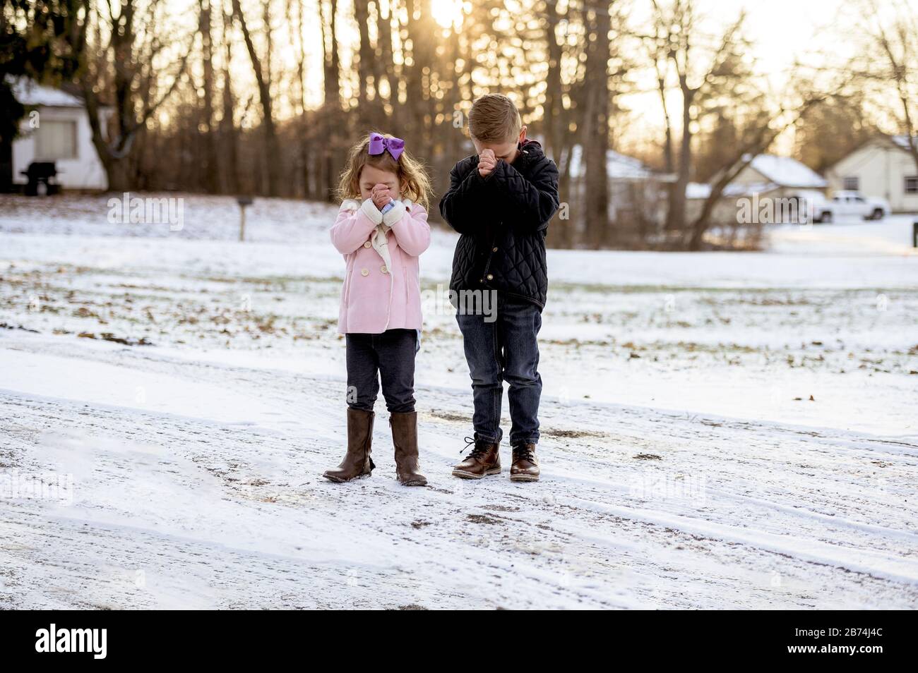 Christian children praying standing hi-res stock photography and images ...