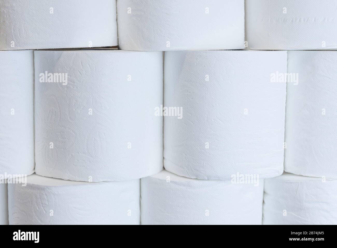 White rolls of toilet paper stack on top of each other.Close up image ...