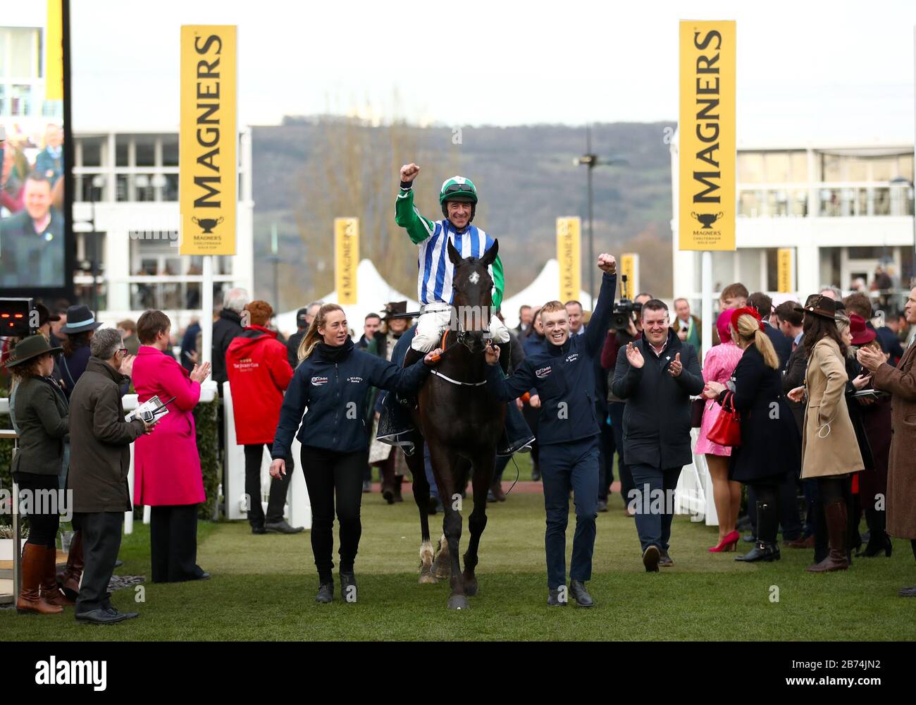 Jockey Davy Russell celebrates winning the Johnny Henderson Grand ...