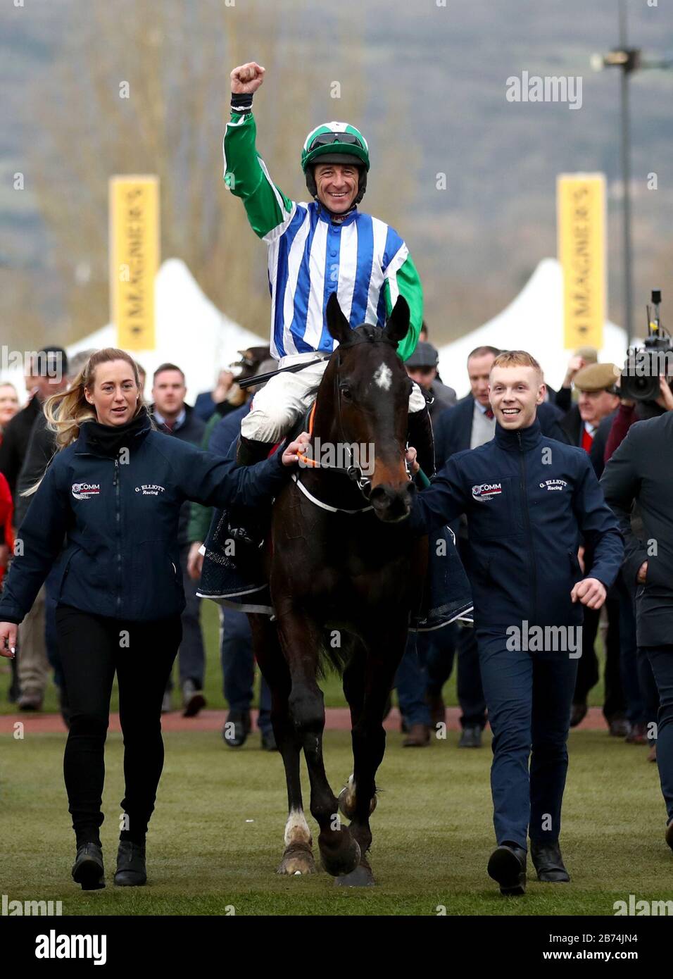 Jockey Davy Russell celebrates winning the Johnny Henderson Grand ...