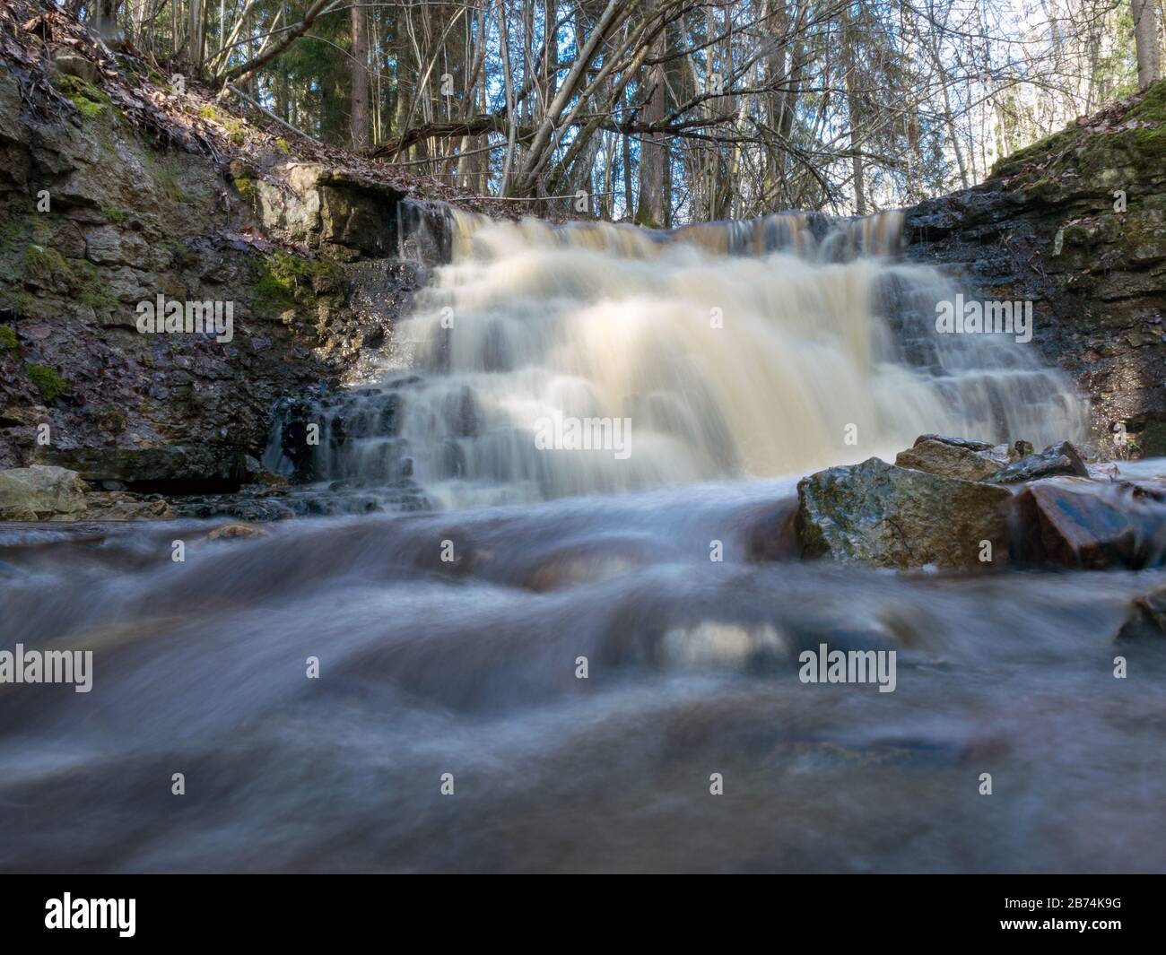 spring landscape with a small waterfall on a small wild river, small ...