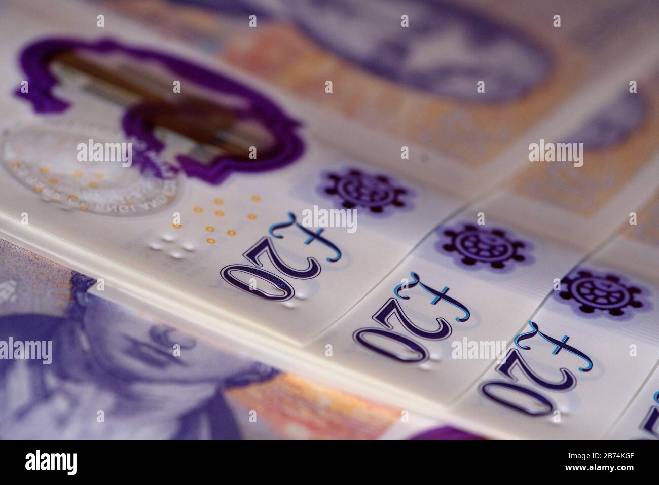 uk twenty pound notes trapped in mousetrap Stock Photo - Alamy