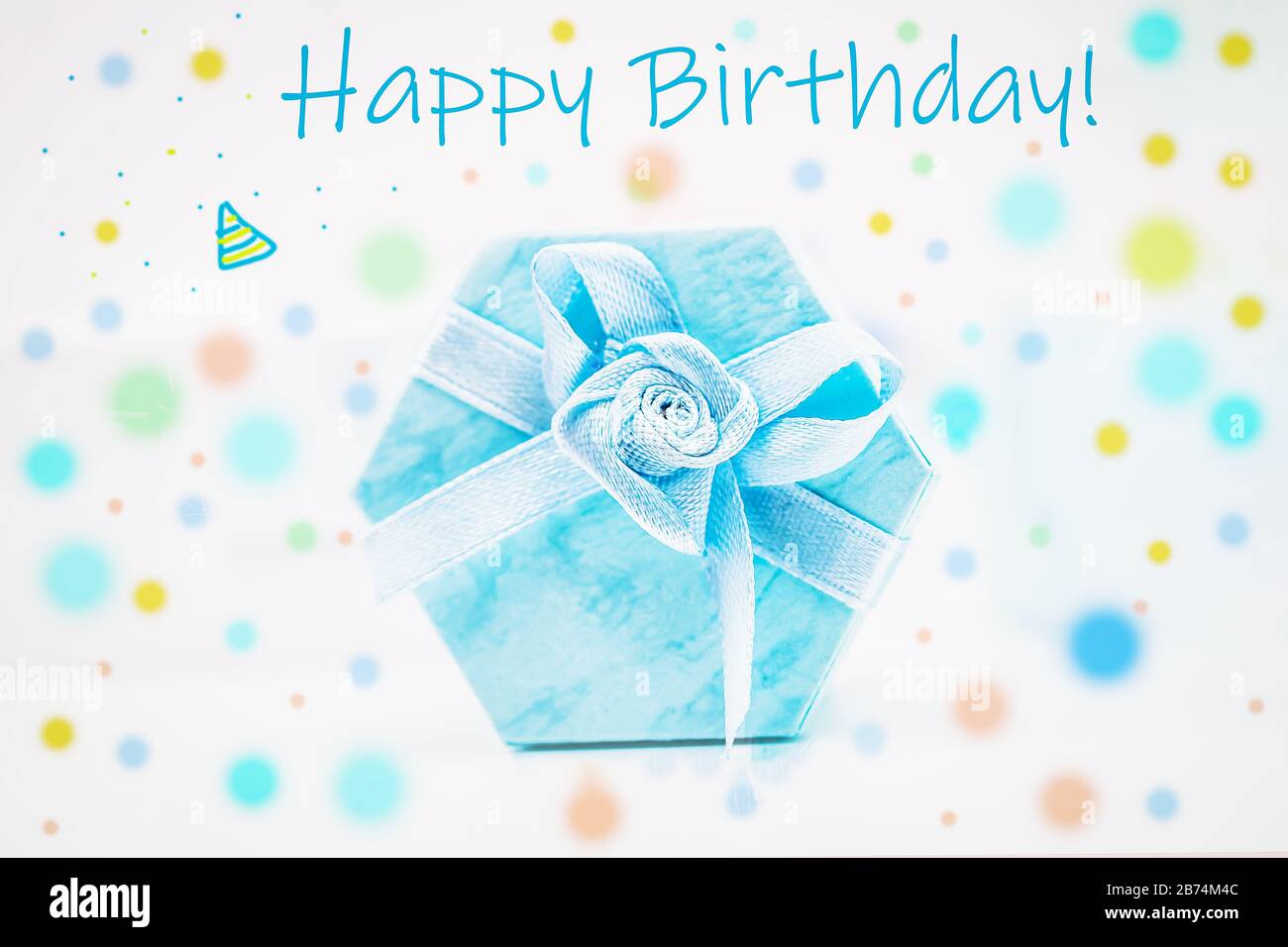 Birthday greeting card. Blue gift box on a festive colored background ...