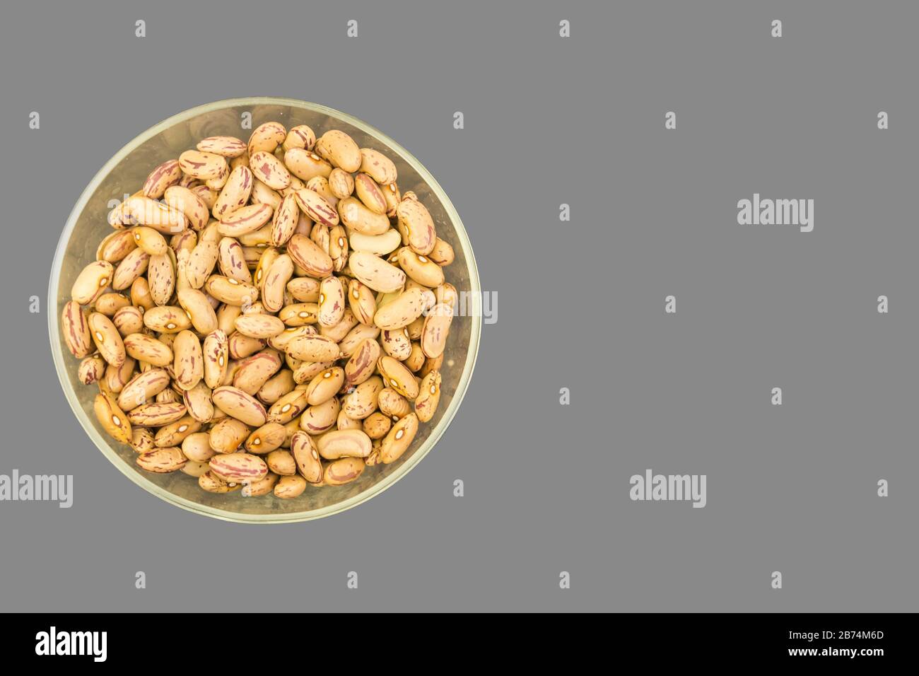 High angle shot of beans in a glass bowl with a grey background Stock ...