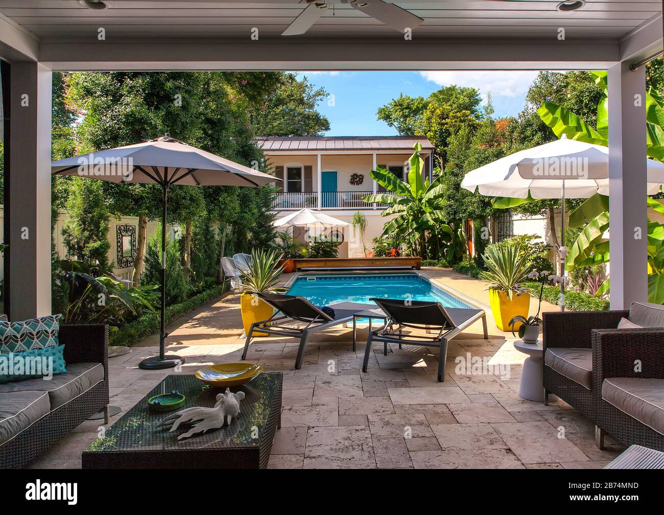 Outdoor furniture , inground pool Stock Photo - Alamy