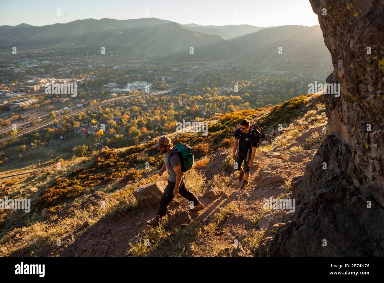 Rock climbers walk along the access trail at Golden Cliffs on North ...
