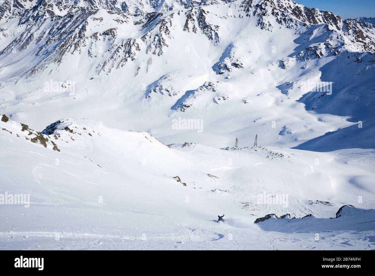 Ski turn with powder snow spraying Stock Photo - Alamy