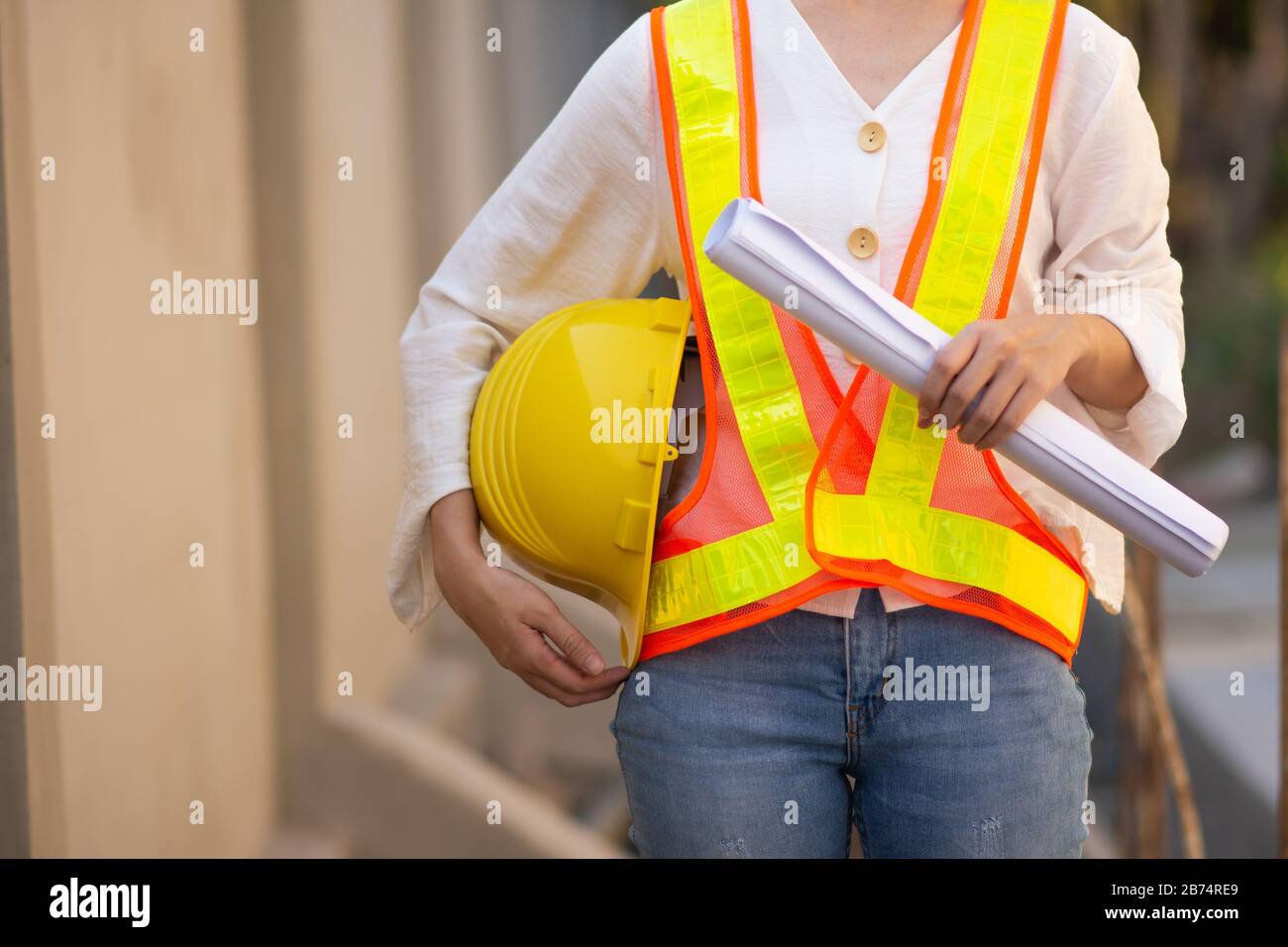 Woman Foreman hard hat safety suit holding blueprint inspection ...
