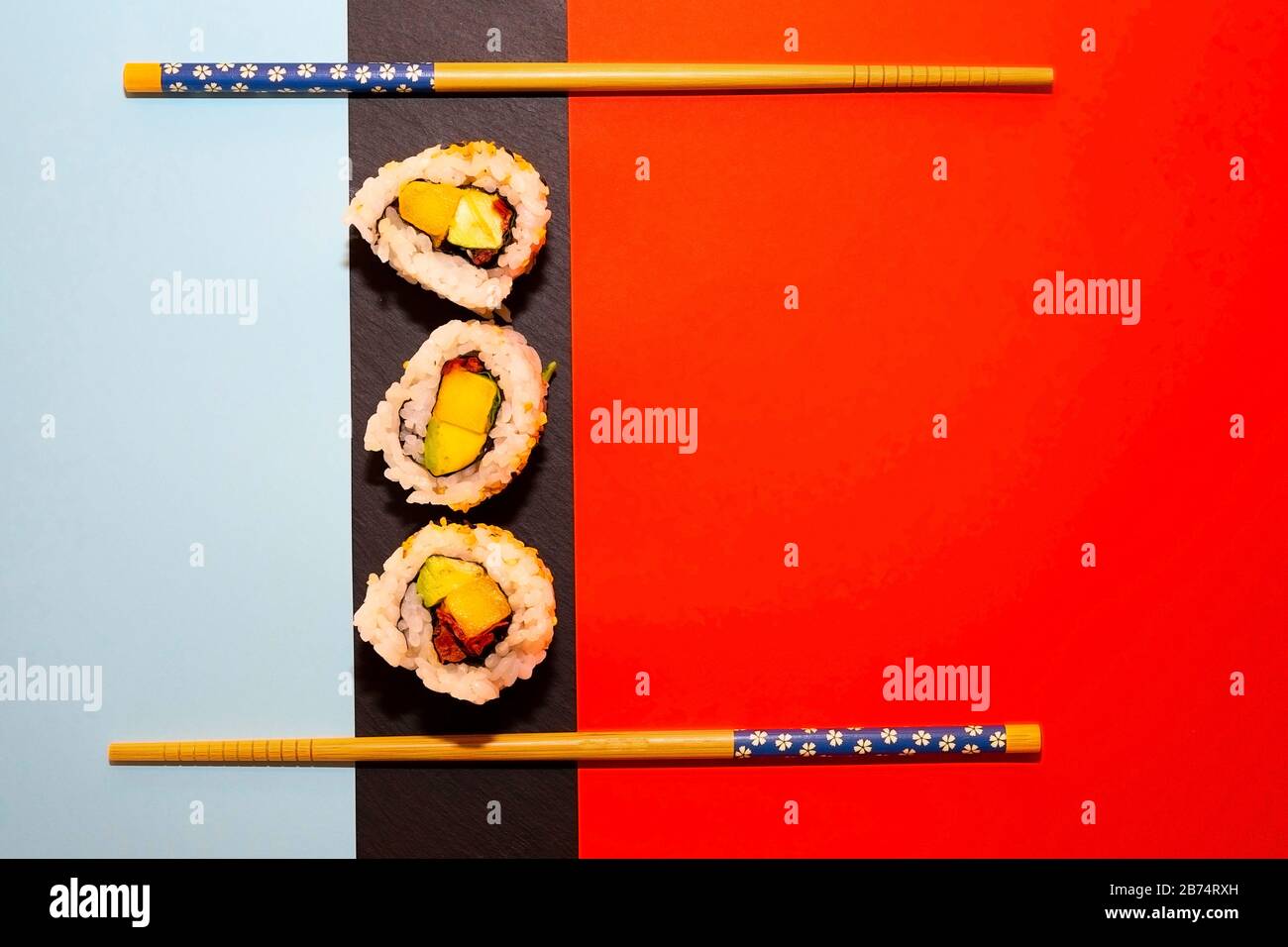 Pieces of vegetarian sushi on a blue and red background. Vegetarian ...
