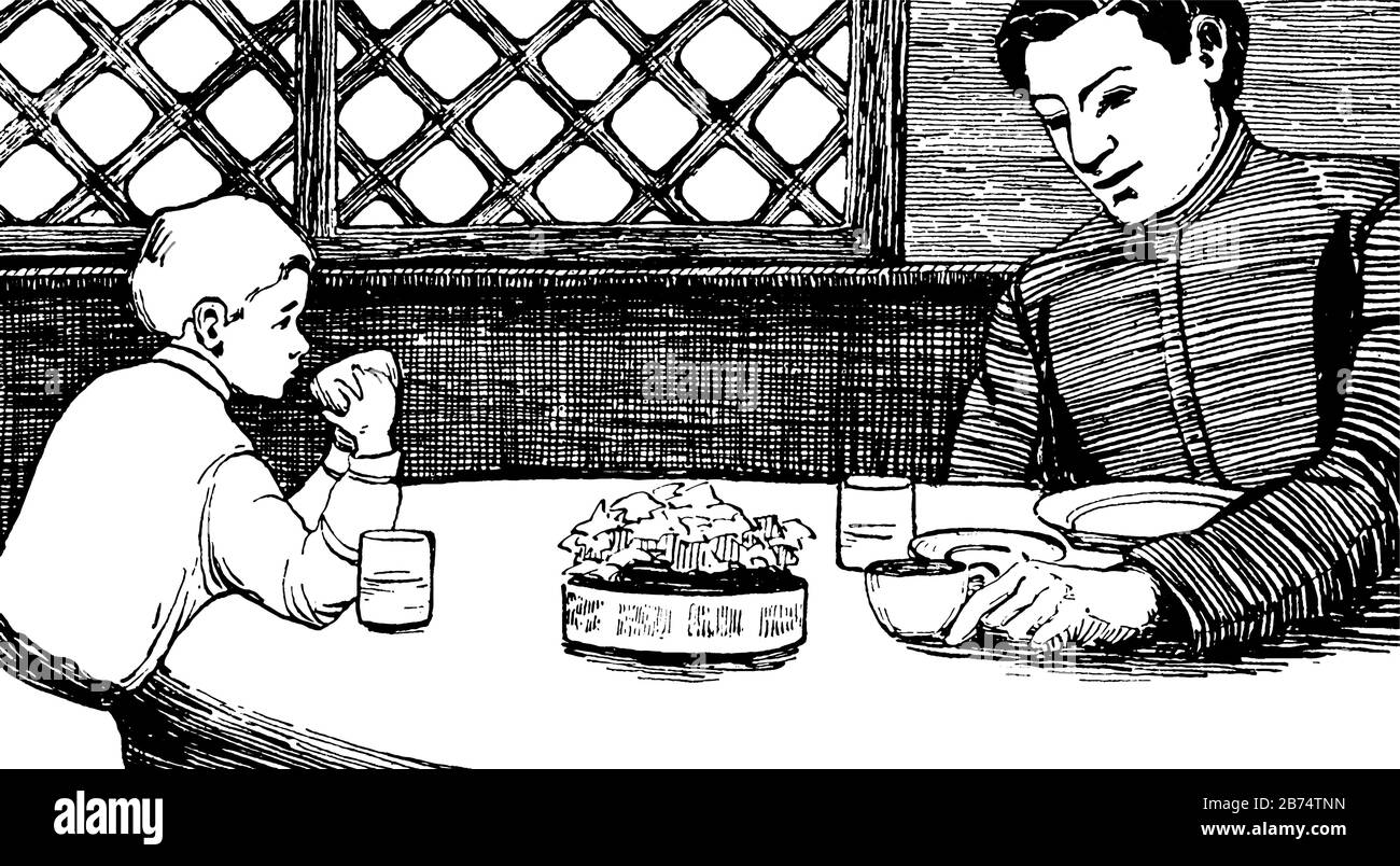 A man and boy sitting on dining table and drinking from cups, glasses ...