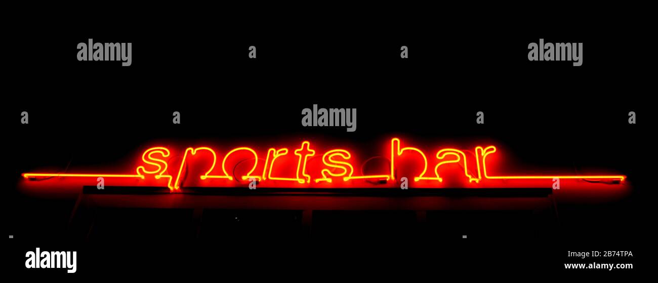Red sports bar neon sign isolated on black background Stock Photo - Alamy