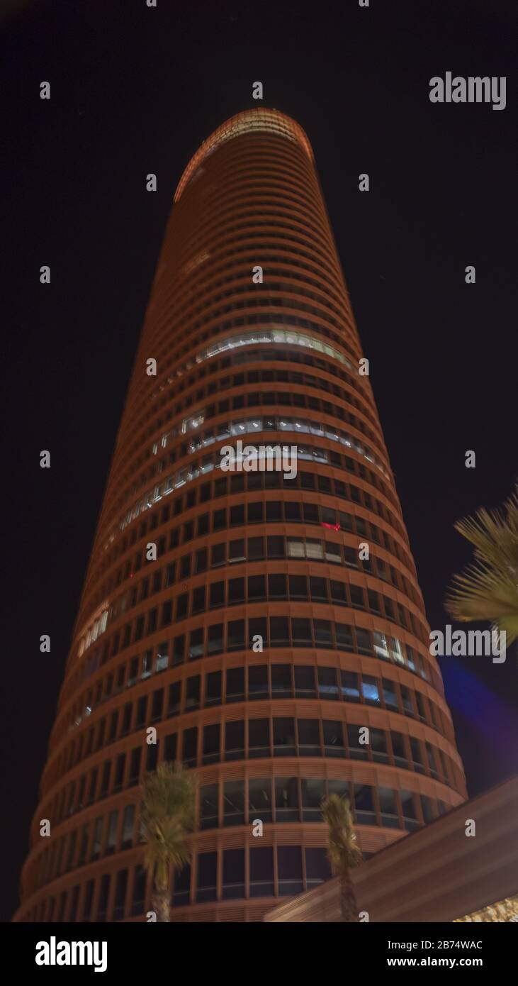 Low angle shot of a tall building at night Stock Photo - Alamy
