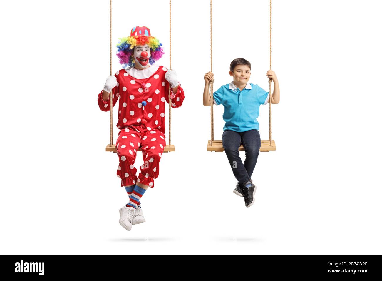 Clown and a boy swinging on swings isolated on white background Stock ...