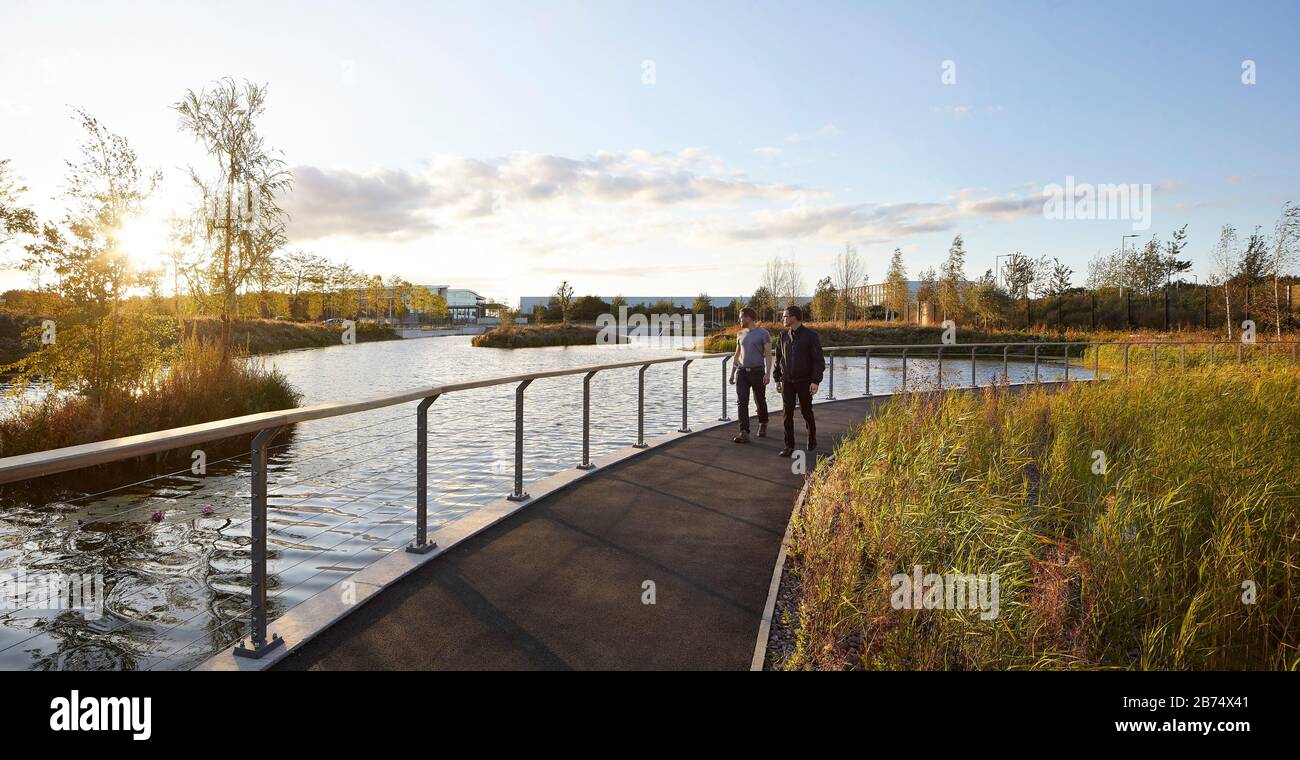 Newly transformed landscape with pond and pedestrian walkways. Jaguar ...