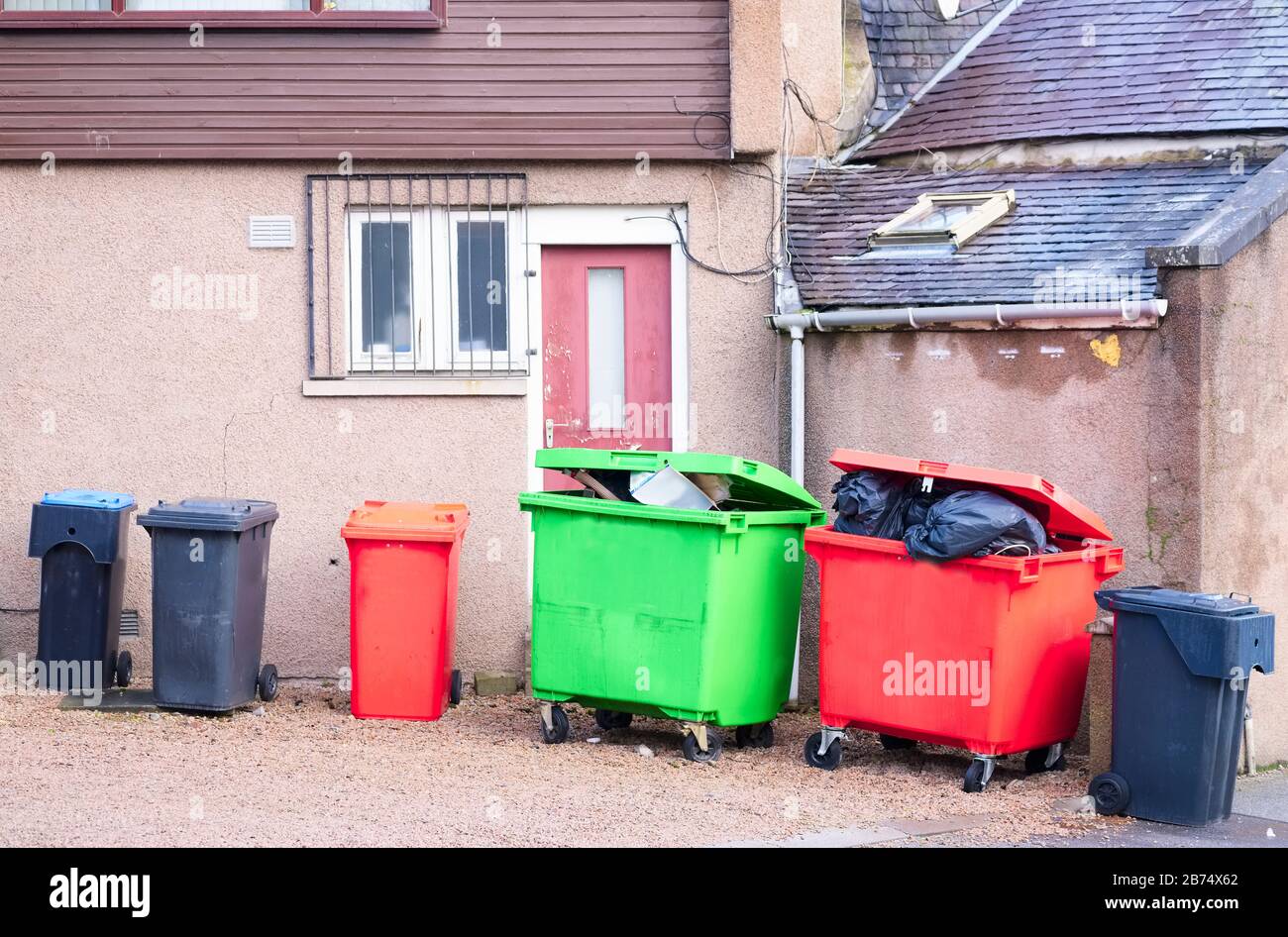 Wheelie bin colour red, green and black for refuge collection outside ...