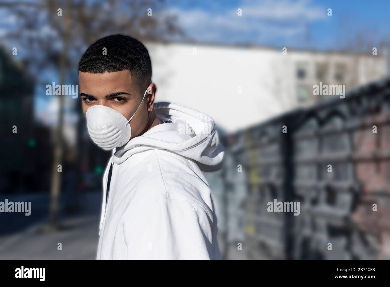 Sick man wearing protective facial mask against transmissible ...