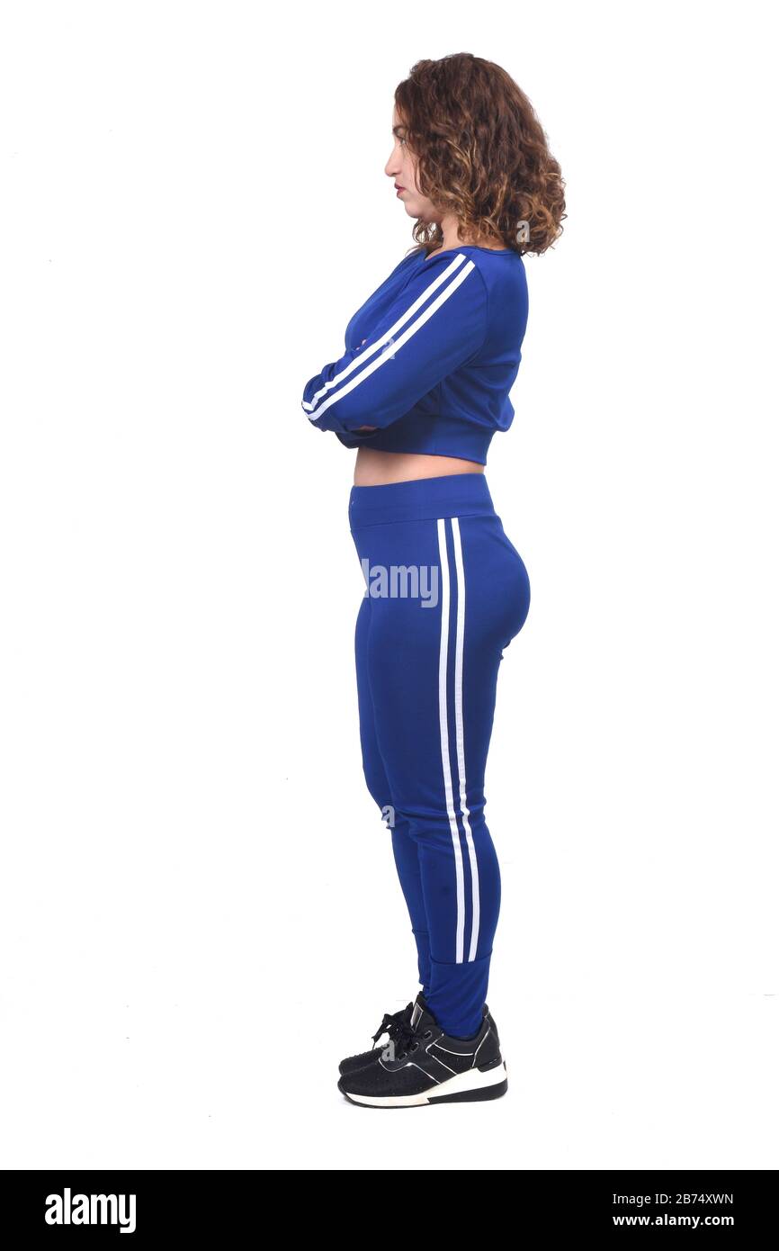side view of a woman in white background, arms crossed Stock Photo - Alamy