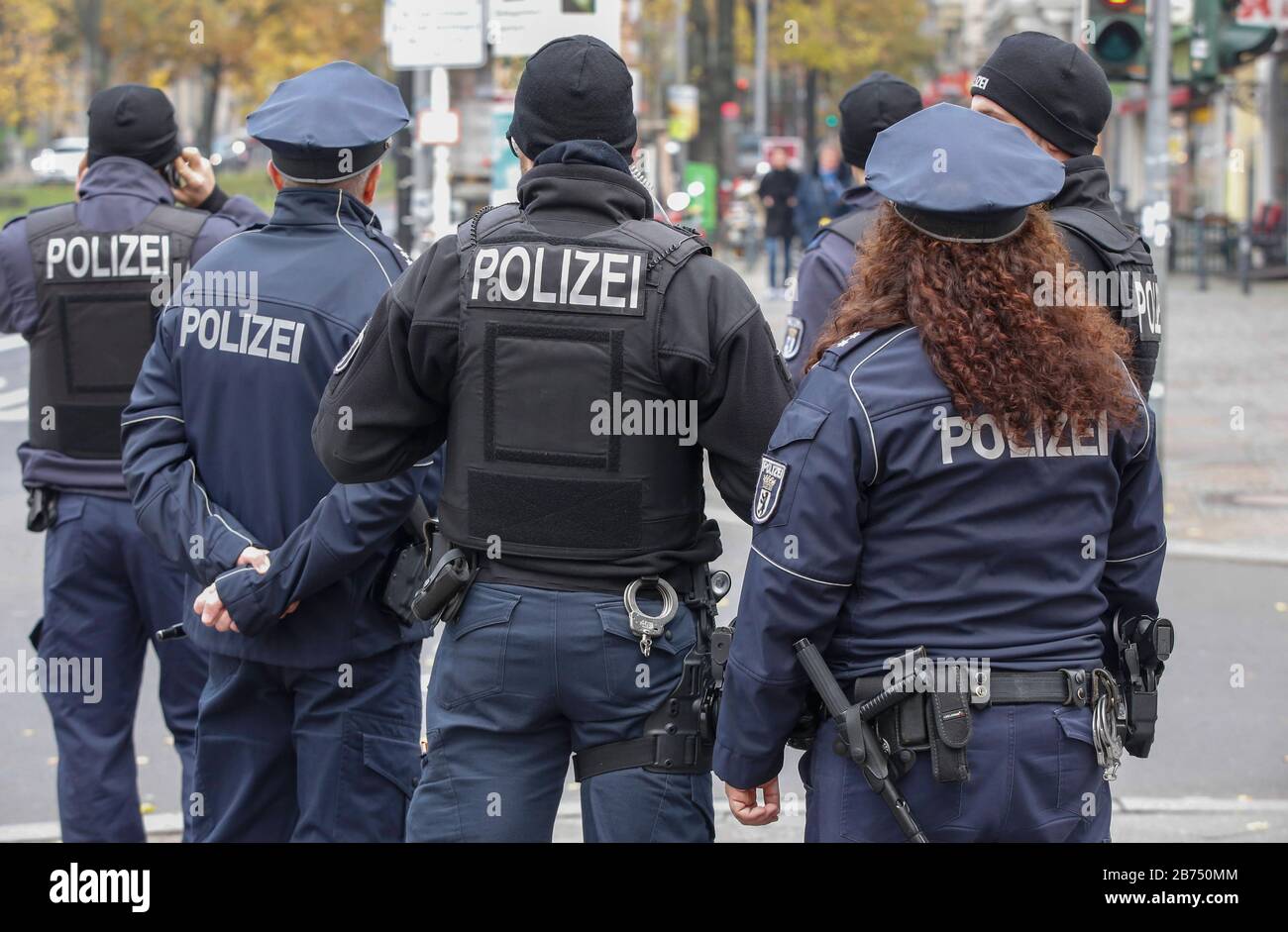 Policemen and a police officer of the Berlin police force on duty at a ...