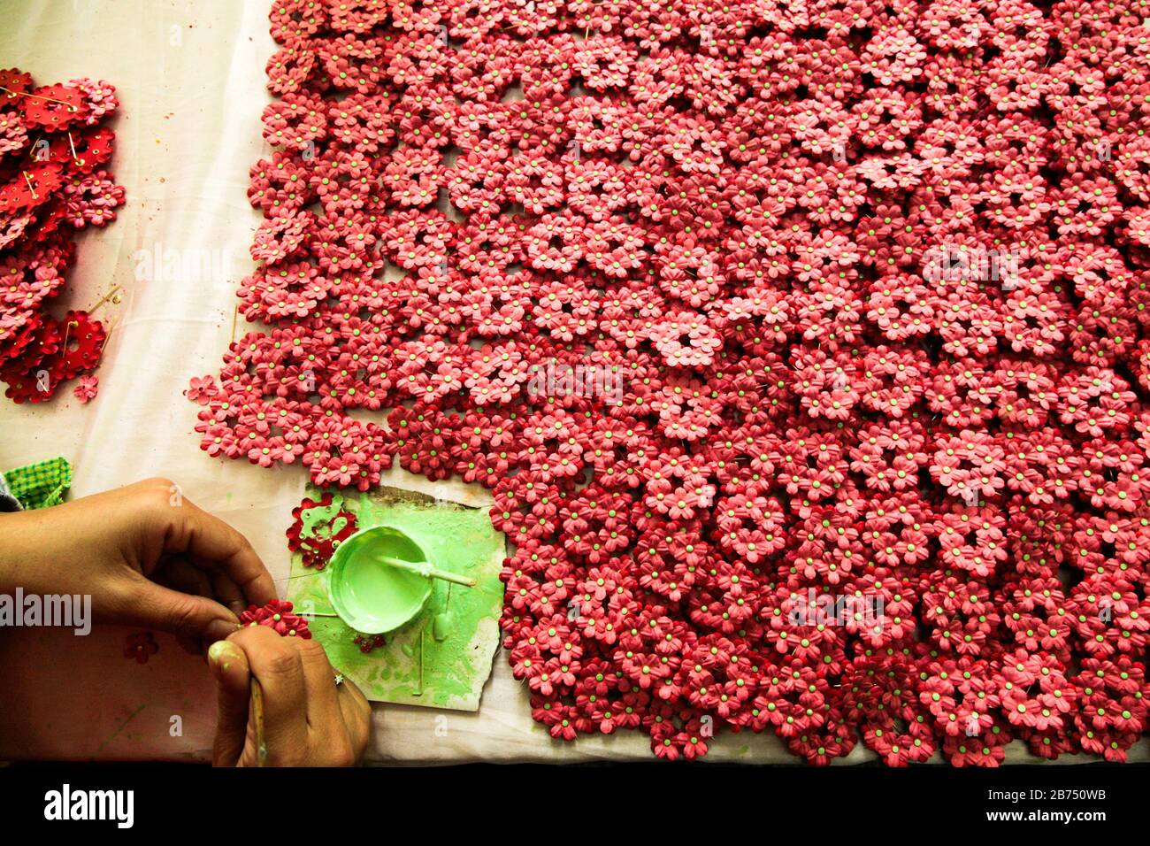 Workers make Remembrance red poppy flower at Good Luck Factory in ...